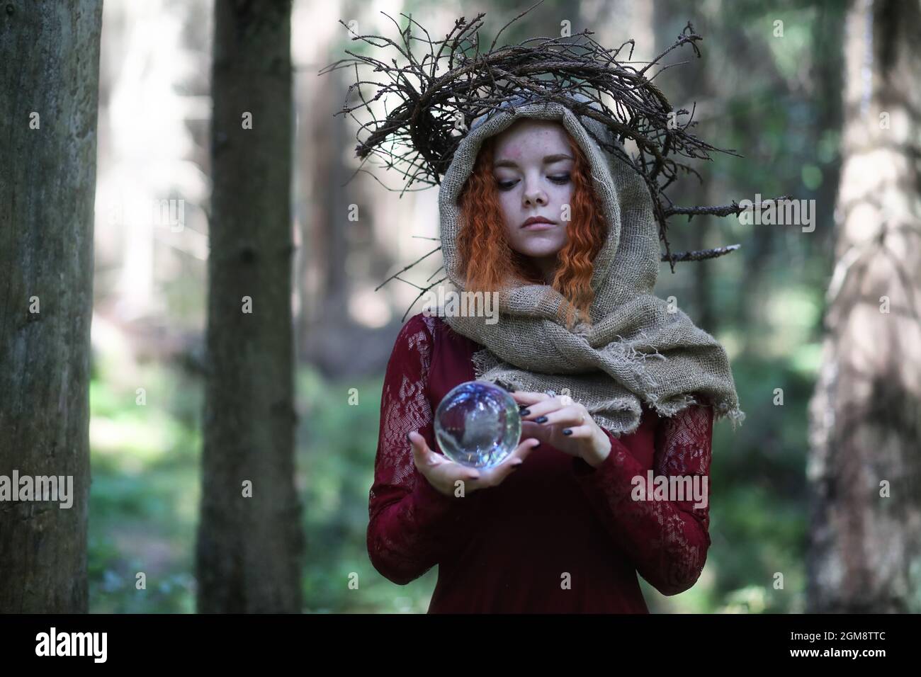 Fortune-teller conducts a ritual in the depths of the forest Stock ...