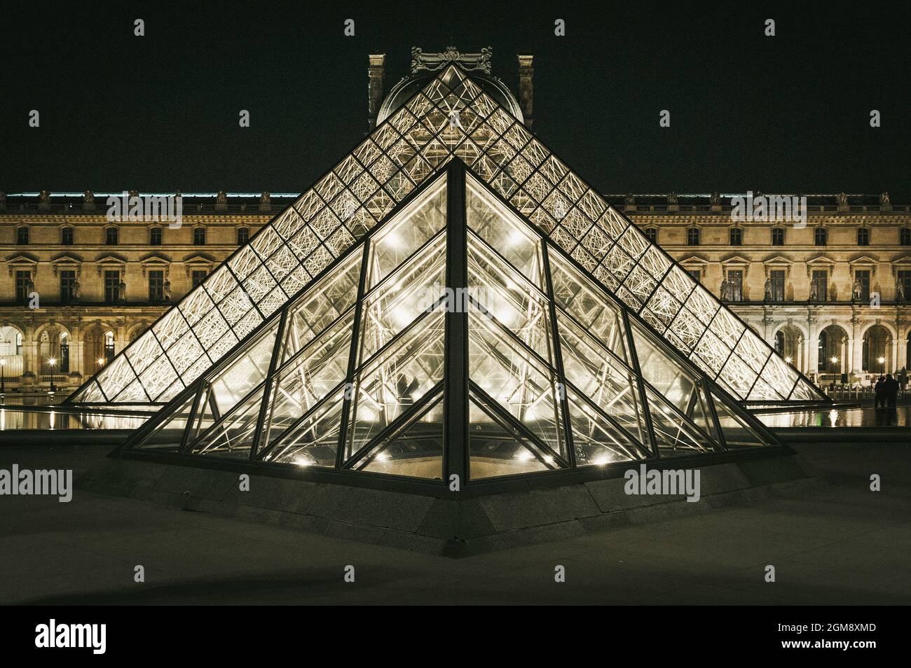 Louvre pyramid at night Stock Photo - Alamy