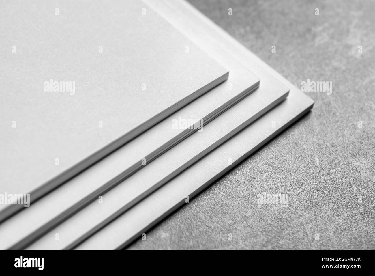 Blank sheets of paper on grey background. Mock up for design Stock ...