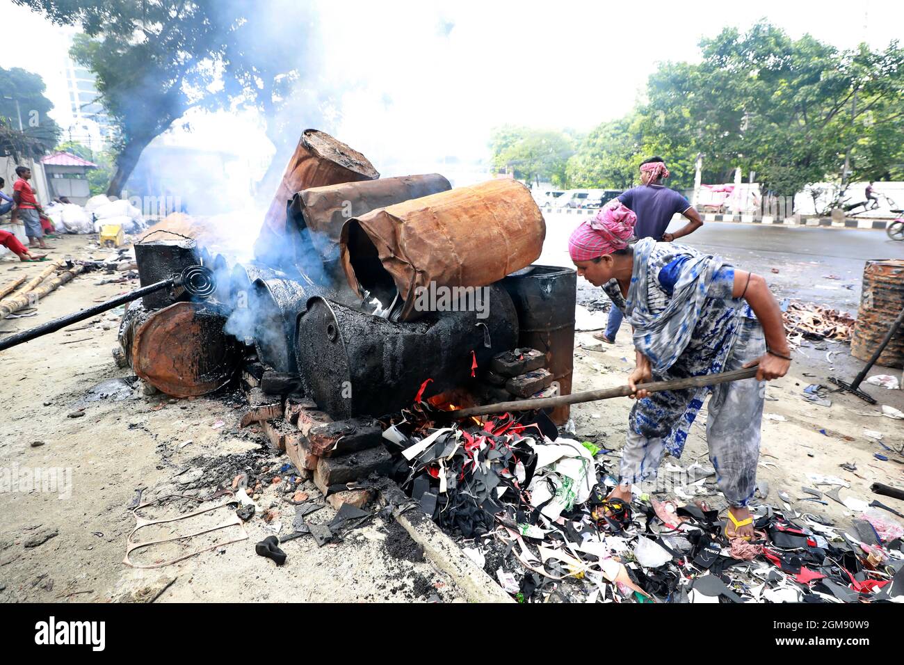 Dhaka, Bangladesh - September 17, 2021: Bangladeshi workers burning ...