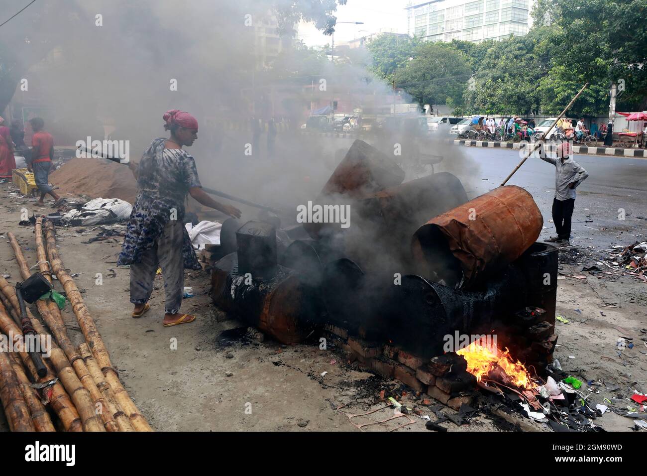 Dhaka, Bangladesh - September 17, 2021: Bangladeshi workers burning ...