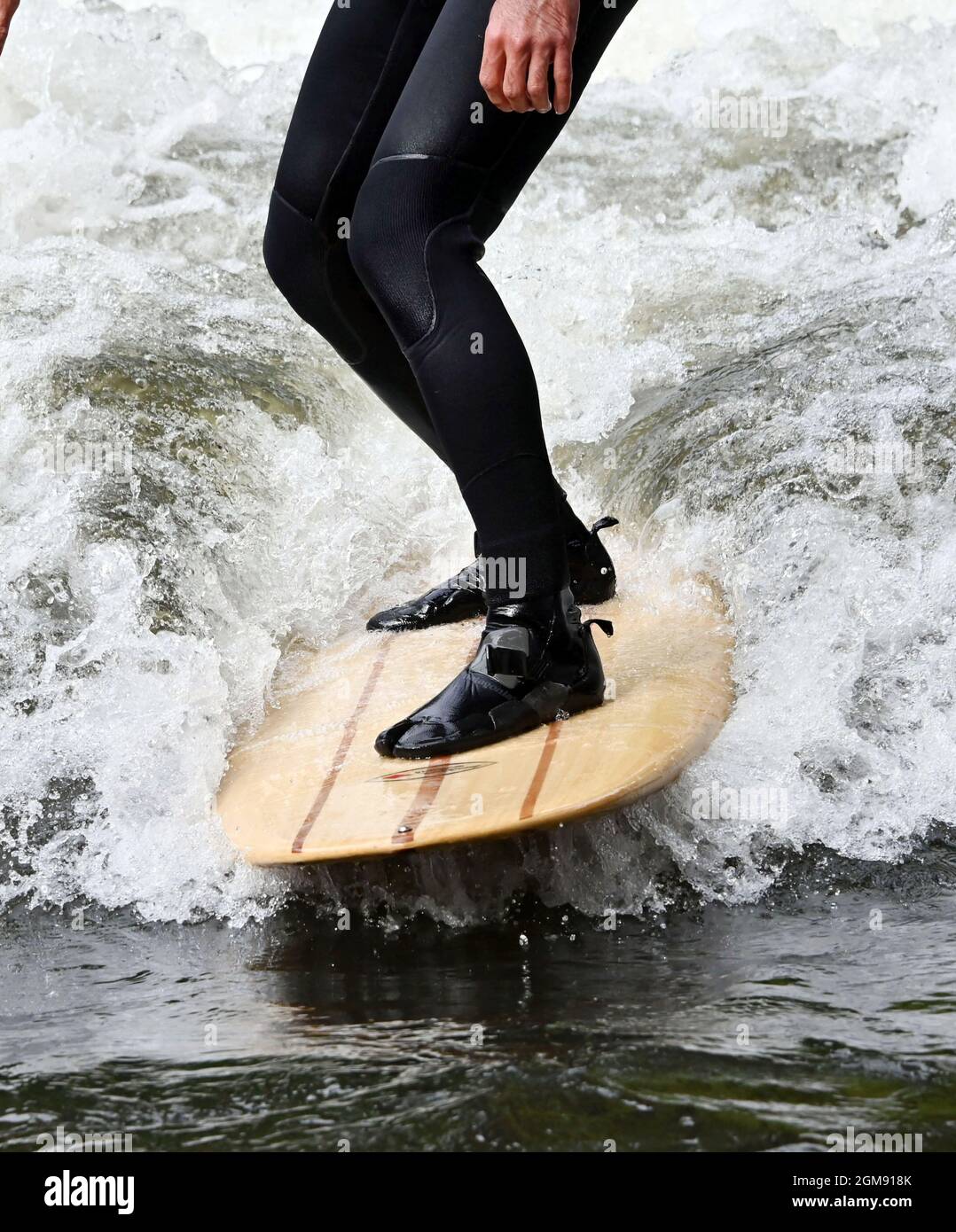 Pforzheim, Germany. 17th Sep, 2021. A person stands on a surfboard in ...
