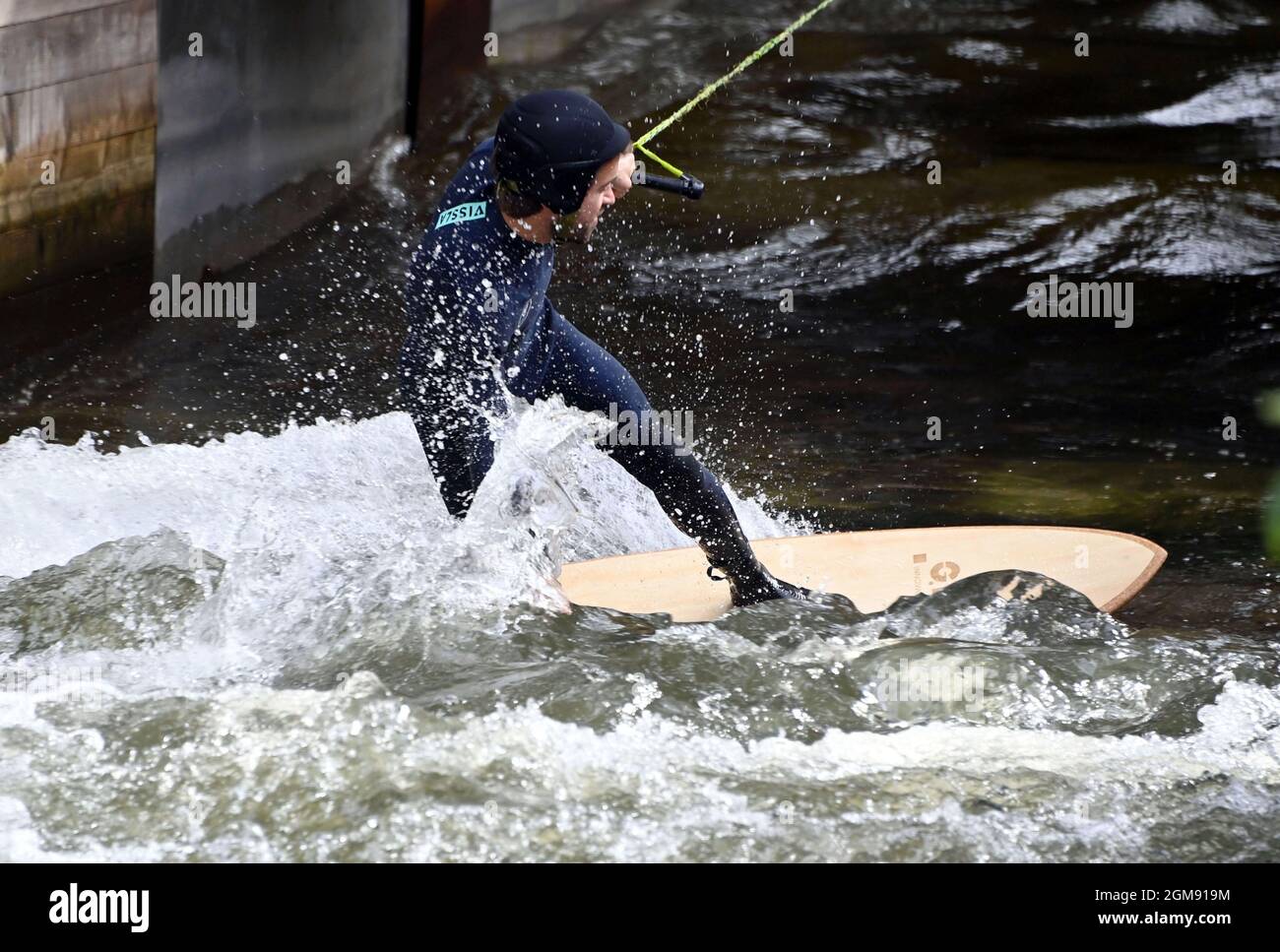 Pforzheim, Germany. 17th Sep, 2021. Steffen Rose stands on a surfboard ...
