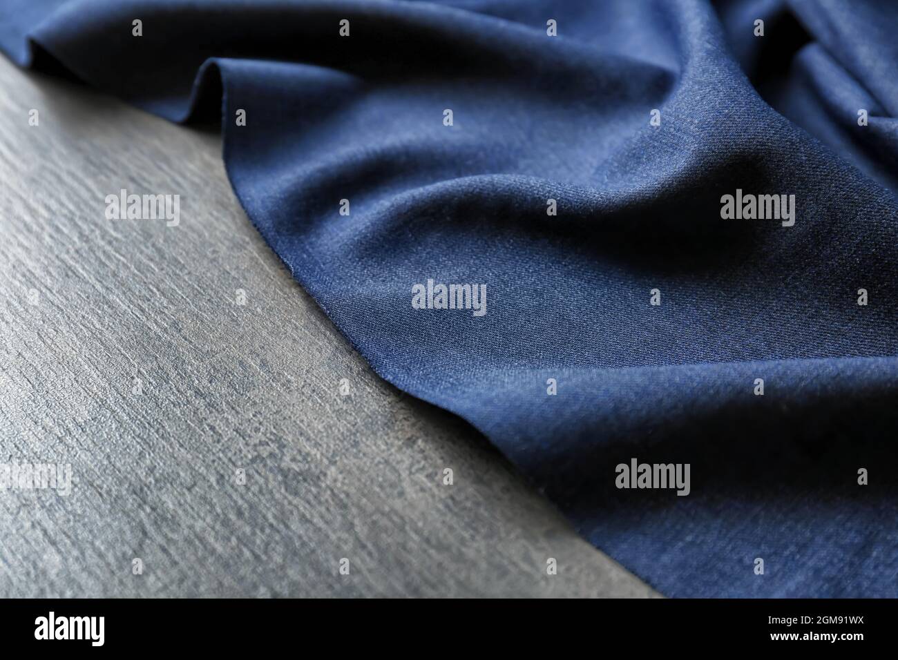 Dark textile on grey background. Fabric texture Stock Photo - Alamy