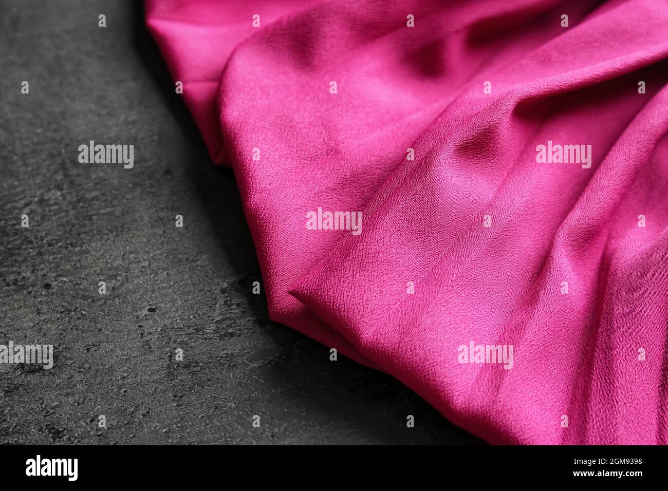 Synthetic textile on dark background. Fabric texture Stock Photo - Alamy