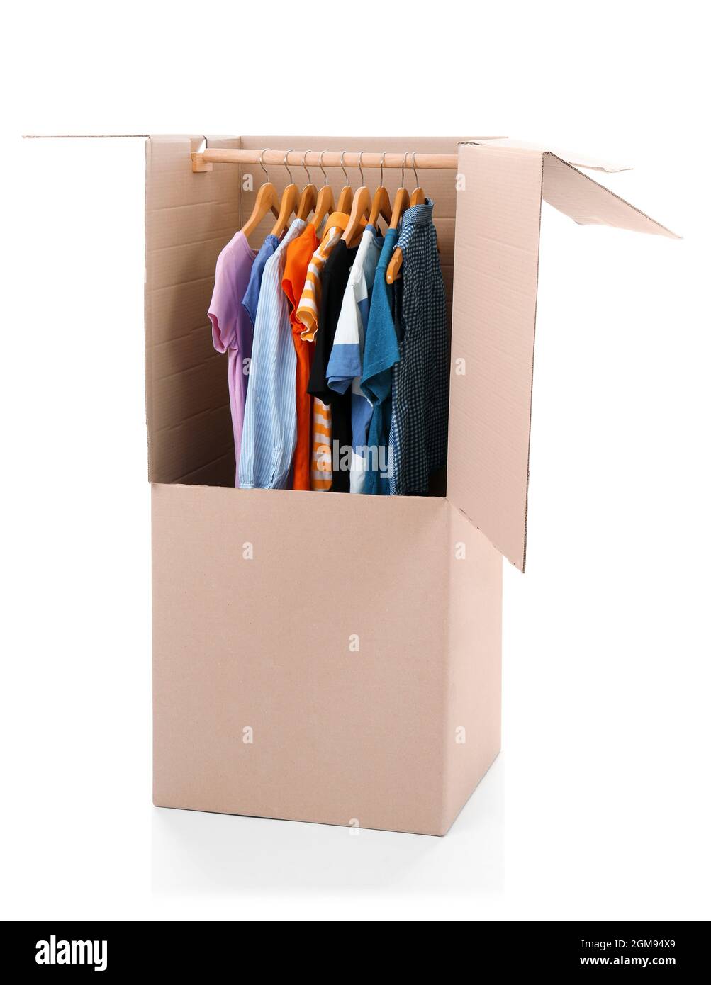 Wardrobe box with clothes on white background Stock Photo - Alamy