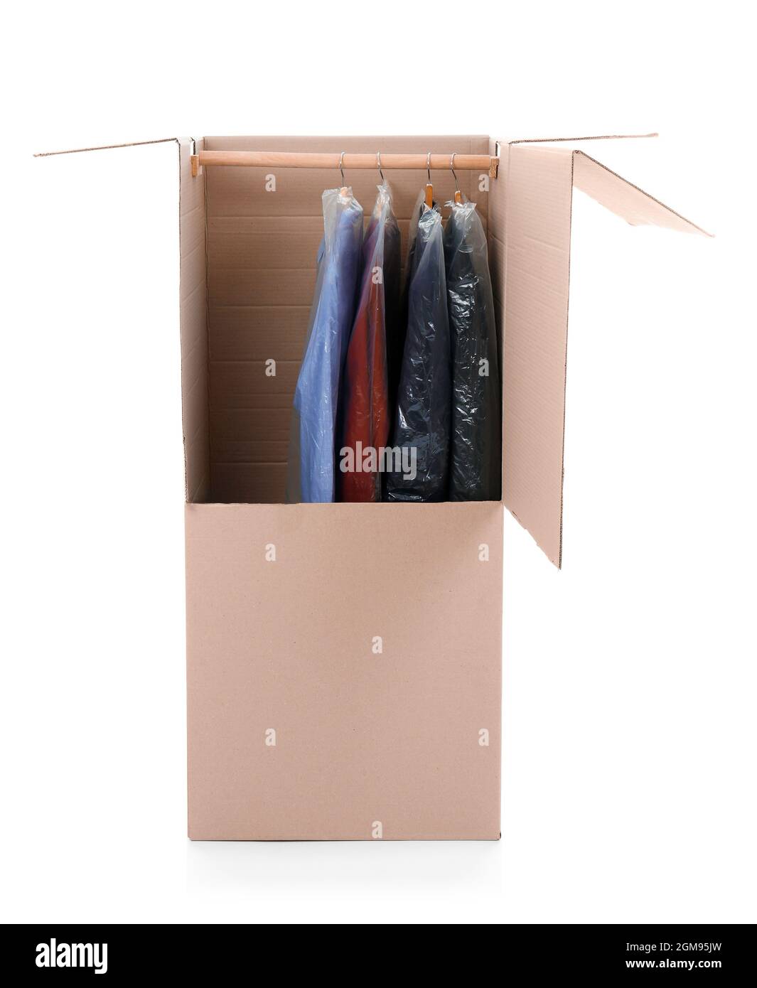 Wardrobe box with clothes on white background Stock Photo - Alamy