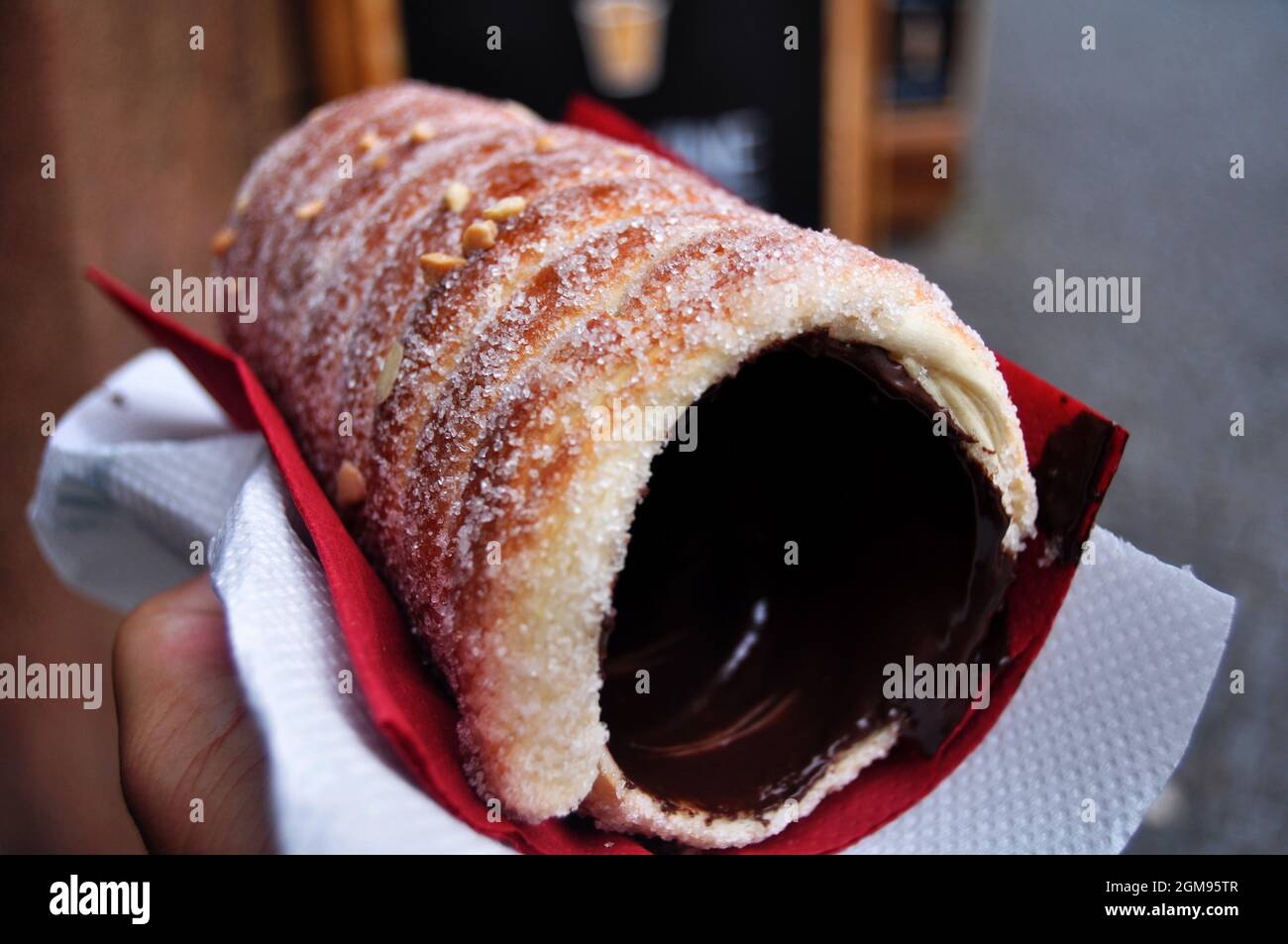 Local czech bread called Trdelnik rolled dough then grilled topped with ...