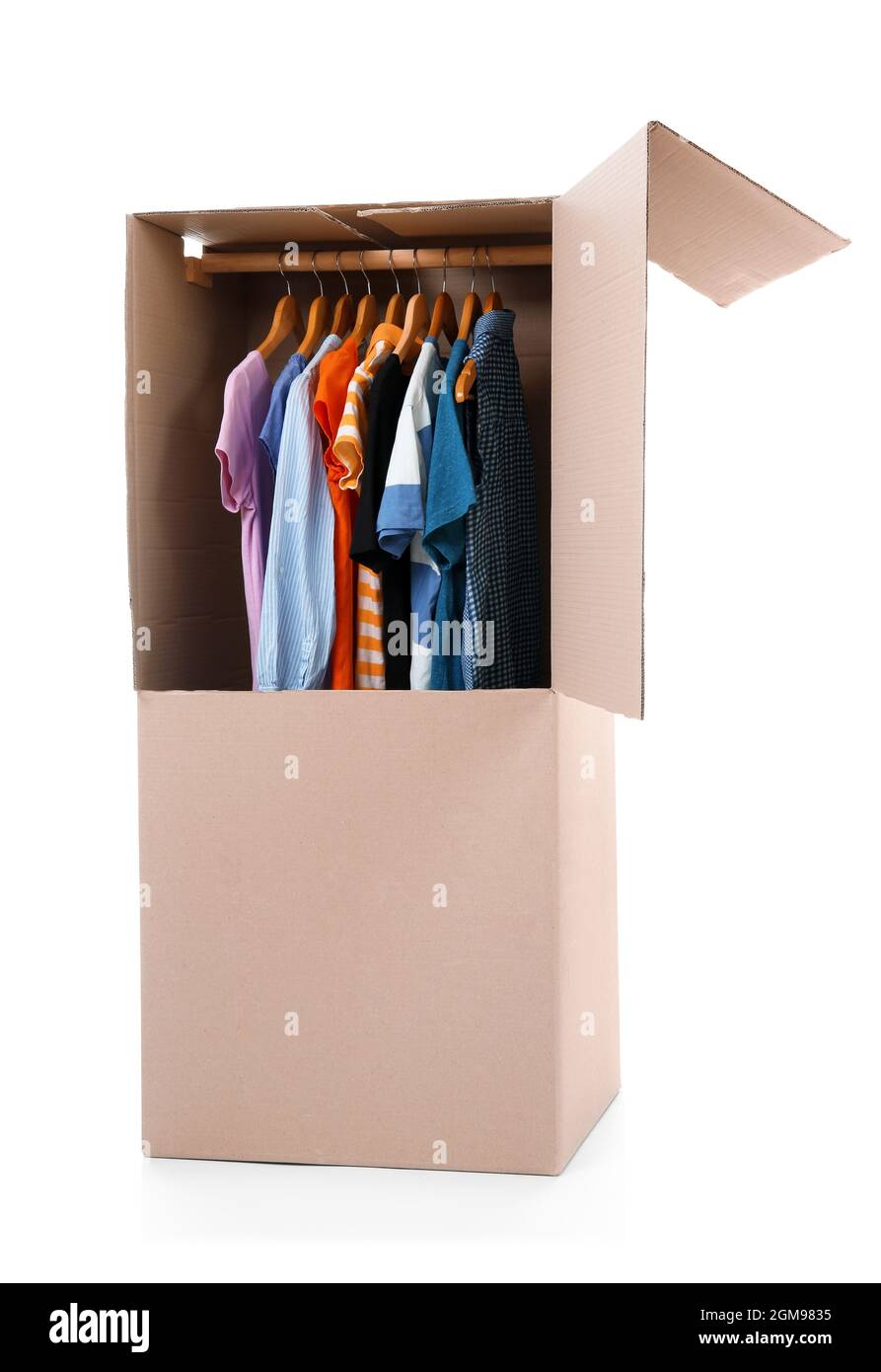 Wardrobe box with clothes on white background Stock Photo - Alamy