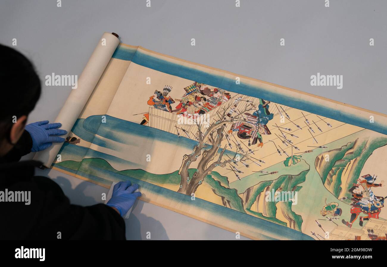 Collections digitisation assistant Ayesha Hussain unrolls one of three ...