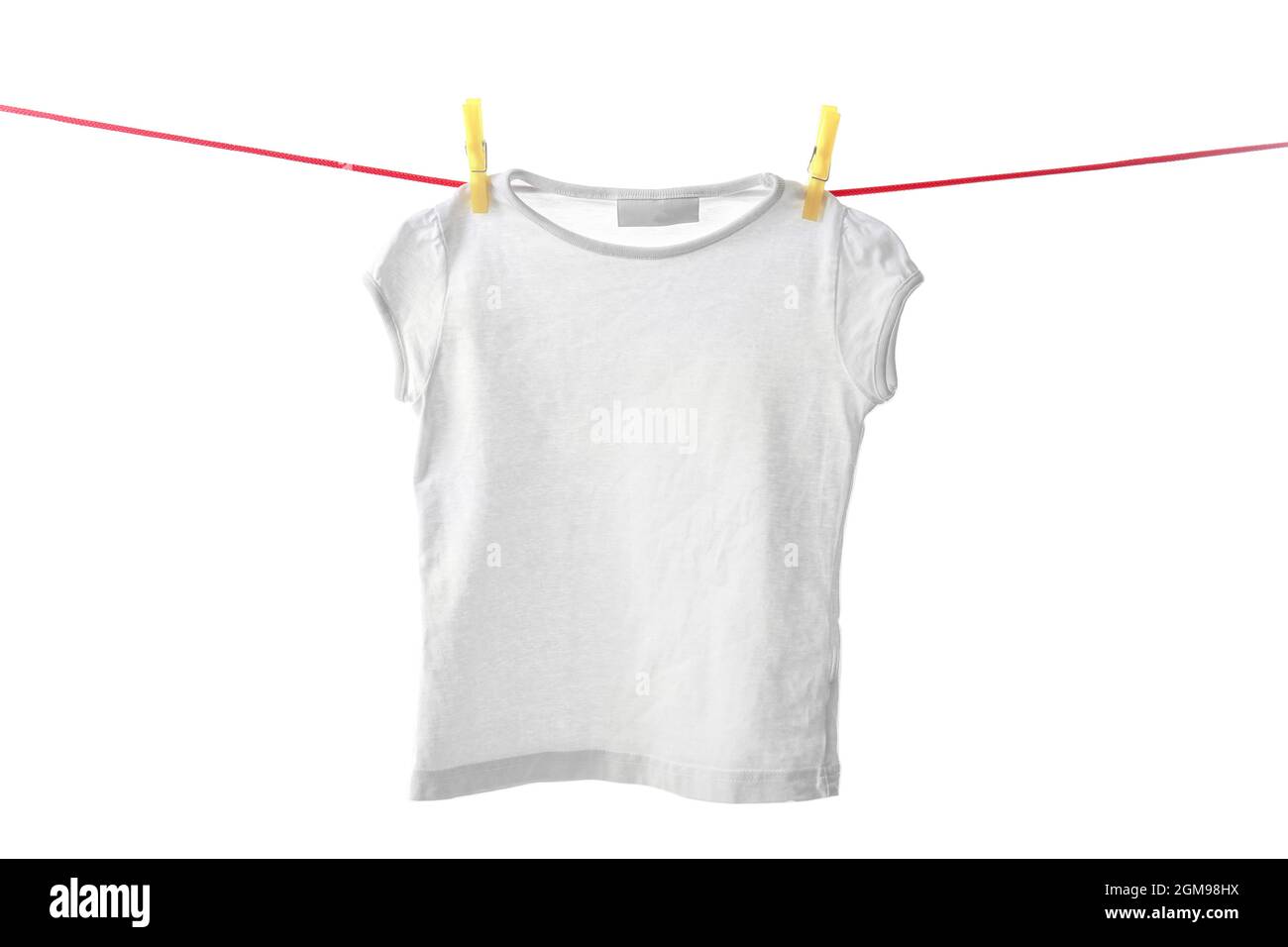 Clean t-shirt on laundry line against white background Stock Photo - Alamy