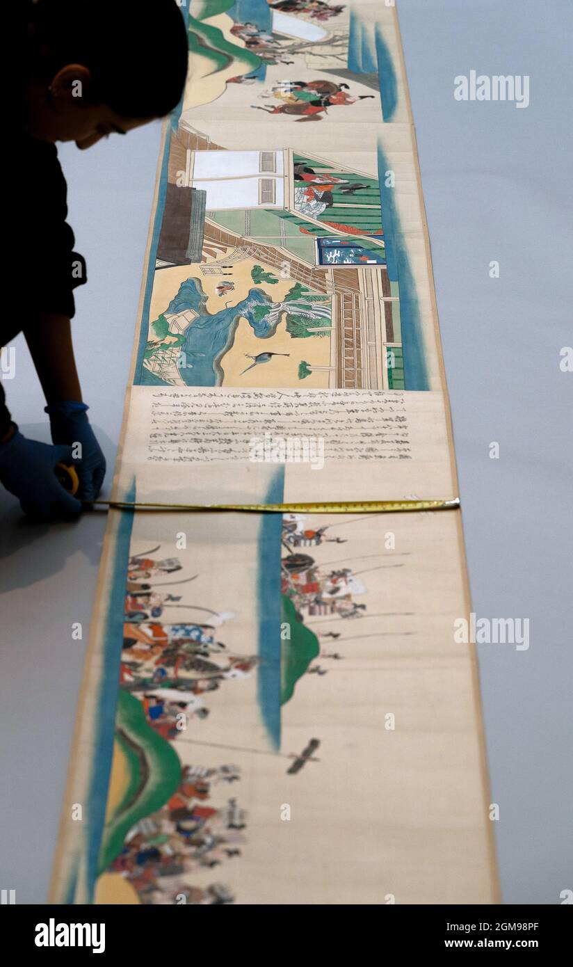 Collections digitisation assistant Ayesha Hussain measures one of three ...