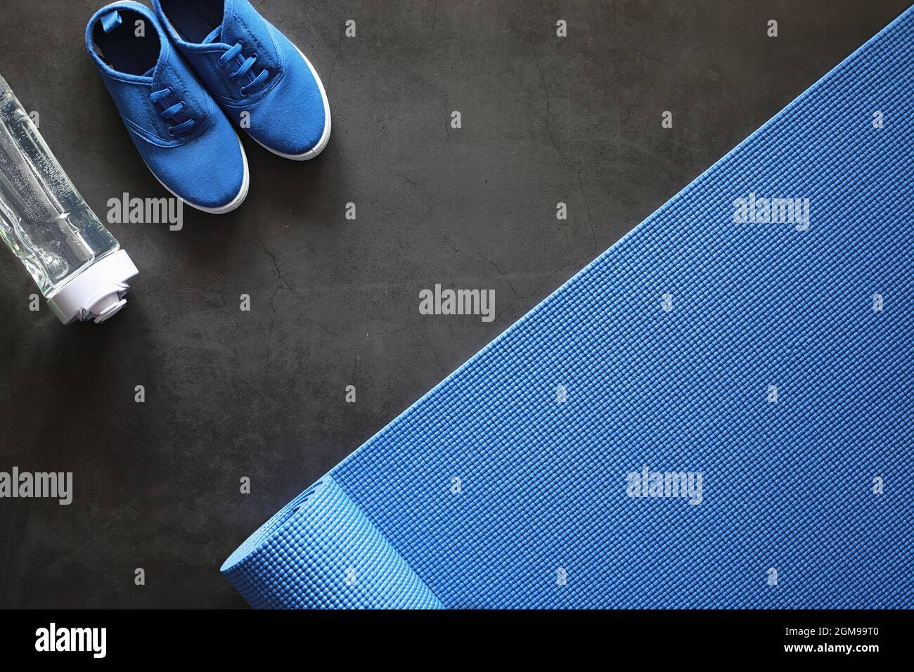 Mat for practicing yoga on a floor. Healthy lifestyle Stock Photo - Alamy