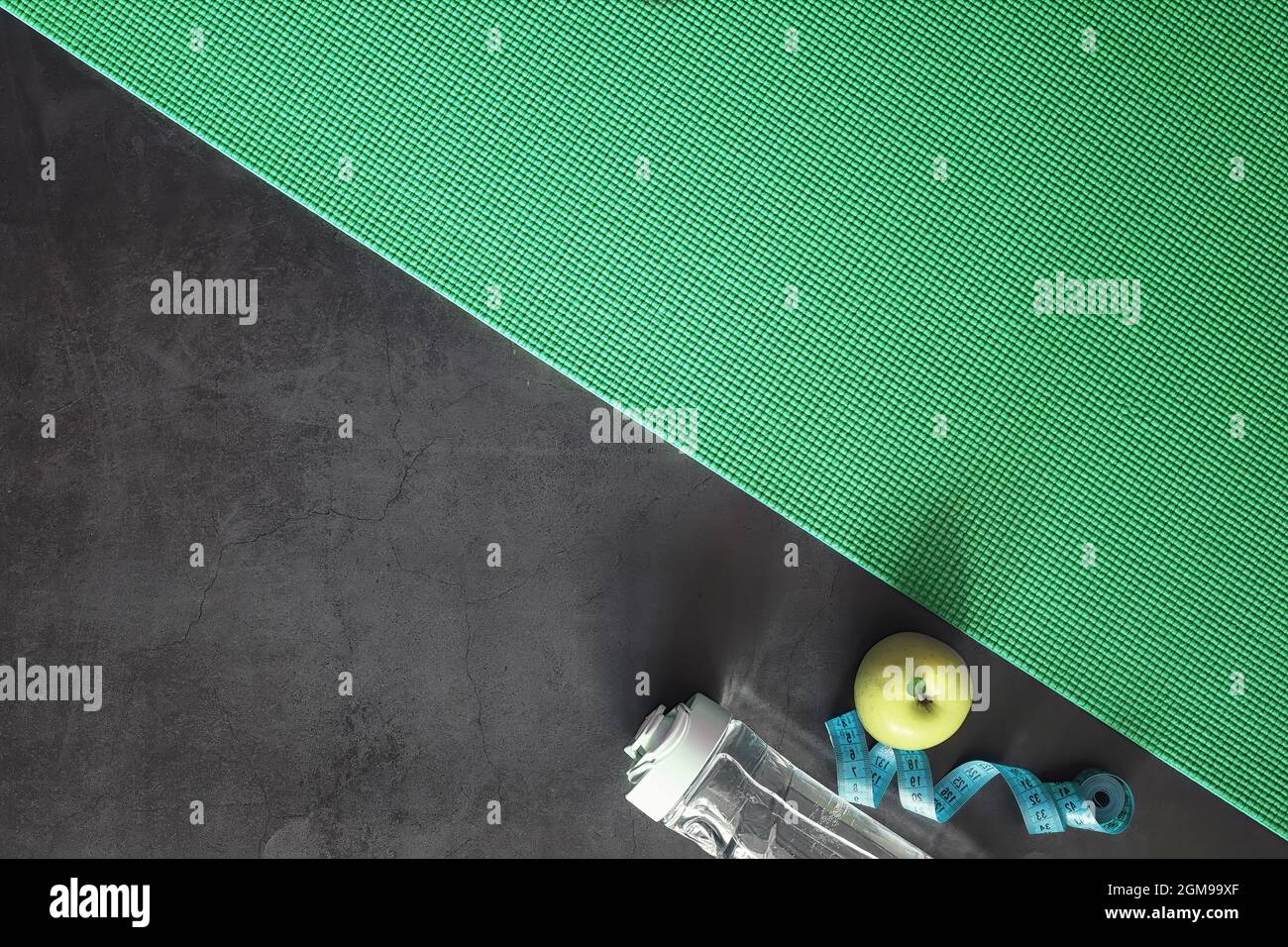 Mat for practicing yoga on a floor. Healthy lifestyle Stock Photo - Alamy