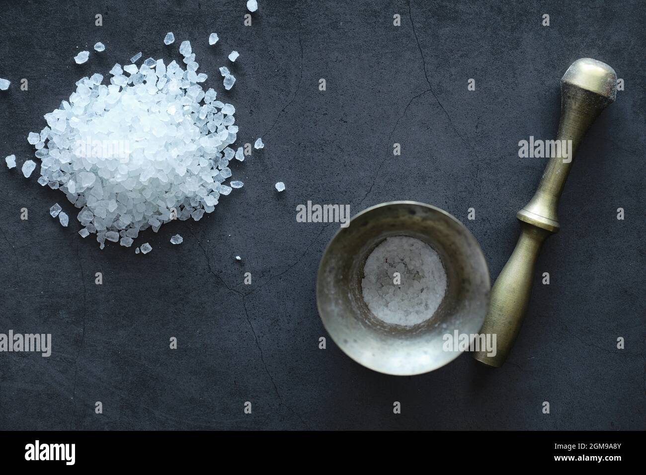 Large sea salt. Spice. Mortar and pestle for grinding salt Stock Photo ...