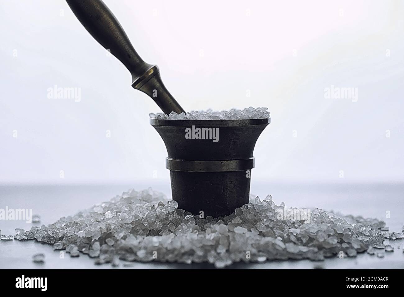 Large sea salt. Spice. Mortar and pestle for grinding salt Stock Photo ...