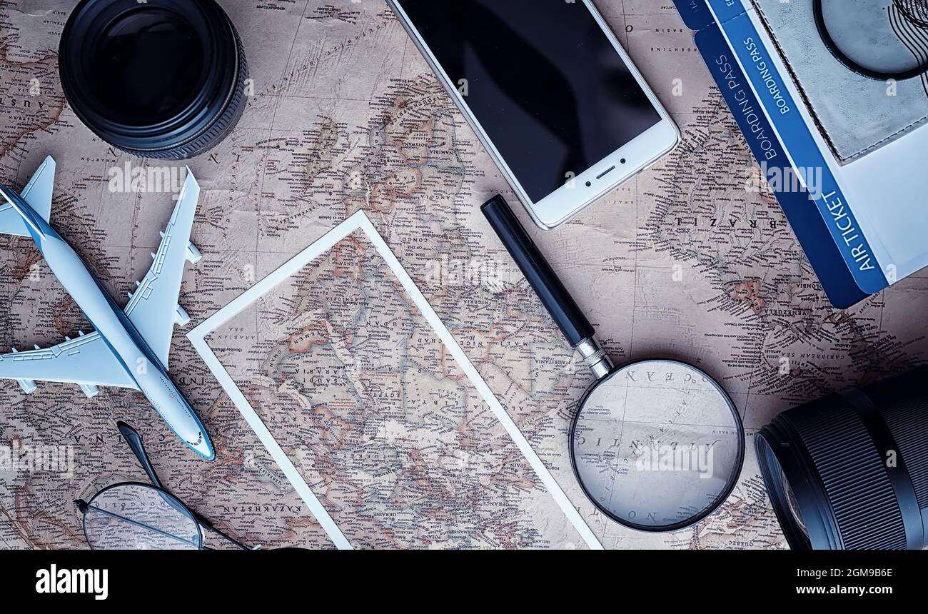 Travel concept. Map on the table and model aircraft Stock Photo - Alamy