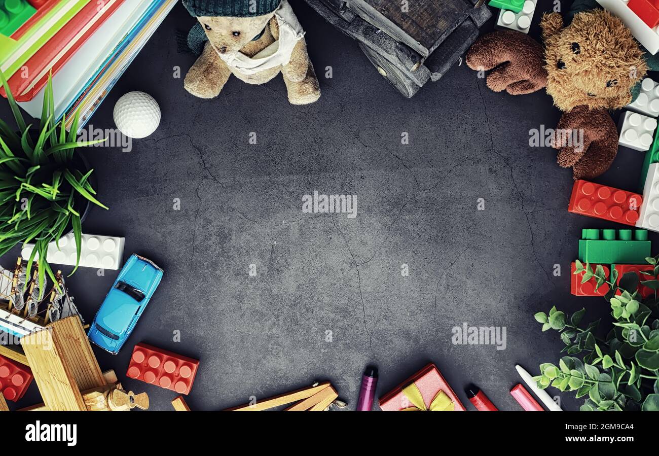 Background. Children's toys on the table. The space between kid's toys ...