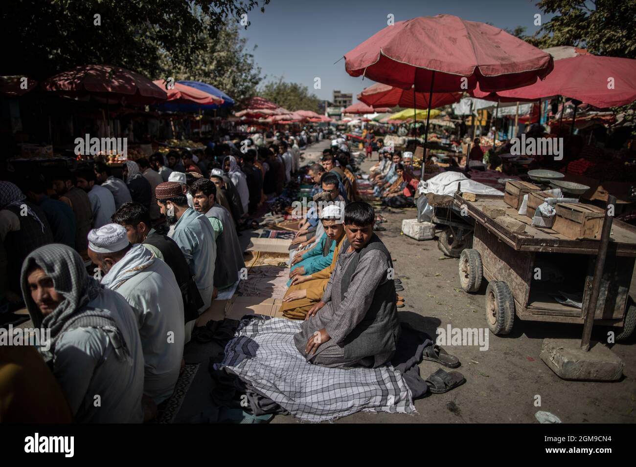 Men attend friday prayers hi-res stock photography and images - Alamy