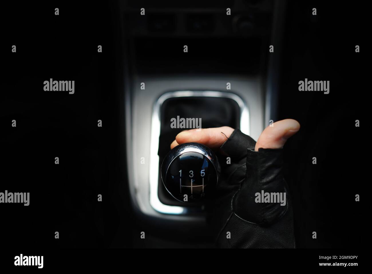 Gear lever. Manual Transmission. Hand on the gear shift in the car ...