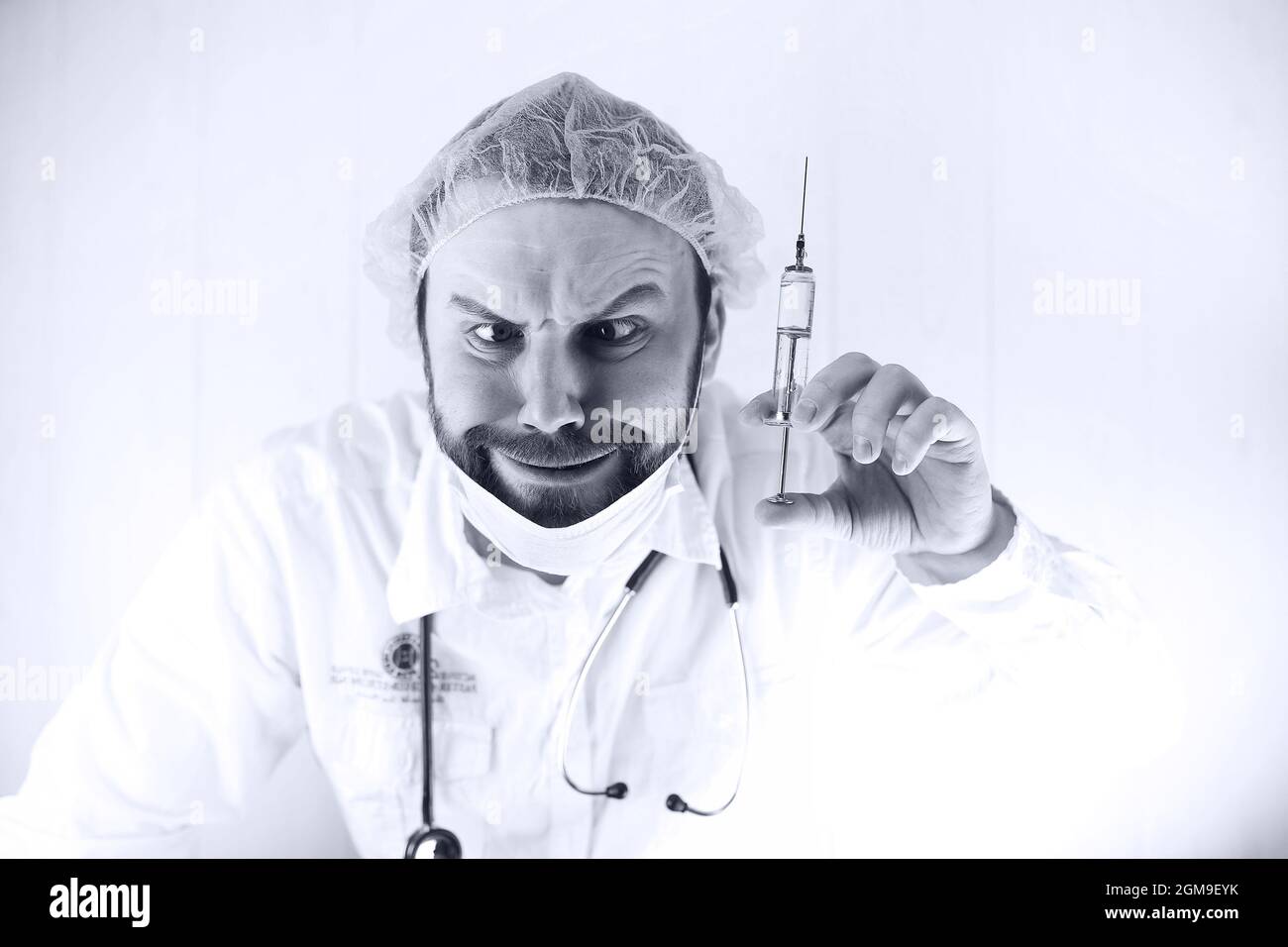 Black and white photo of bearded doctor in a white coat and an old ...