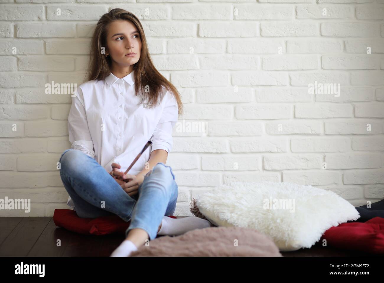 Beautiful girl artist at work in a creative white studio Stock Photo ...