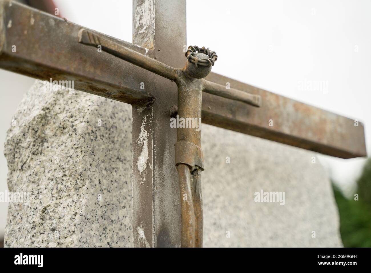 Low angle shot of a rusty metal cross with Jesus Christ on it Stock ...