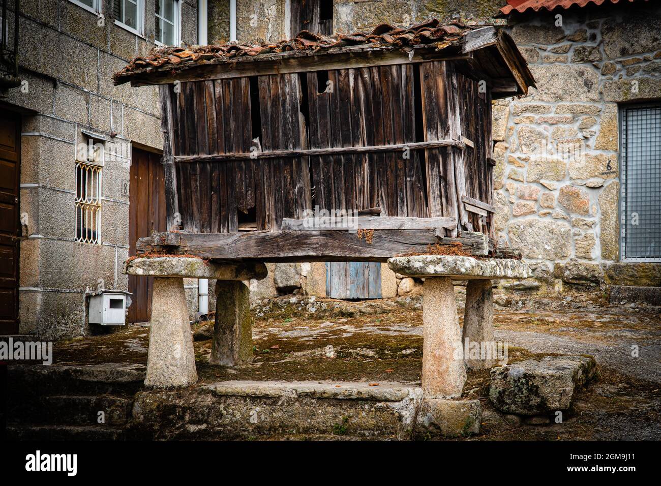 Rusty building on columns Stock Photo - Alamy