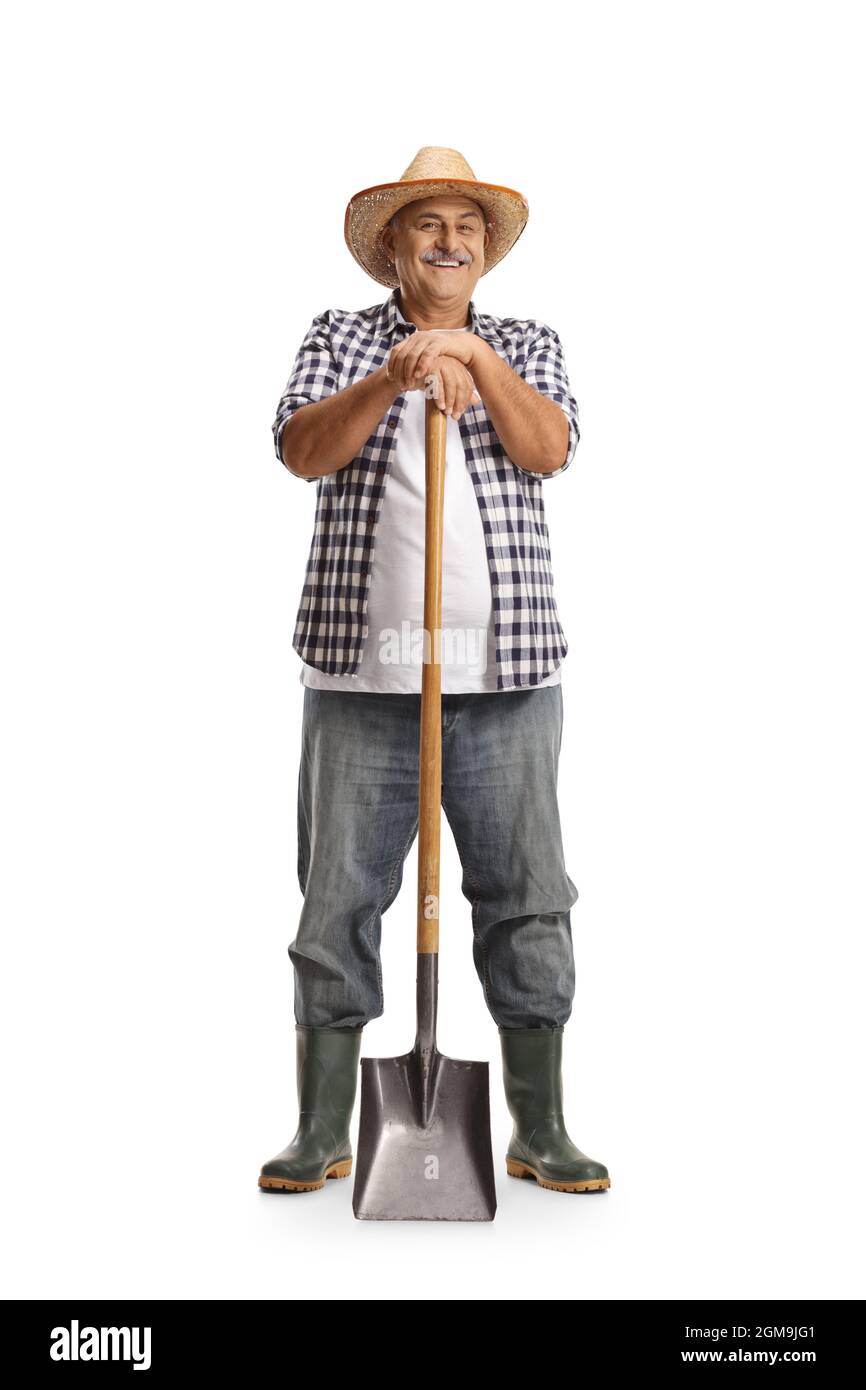 Full length portrait of a mature farmer leaning on a shovel and smiling ...