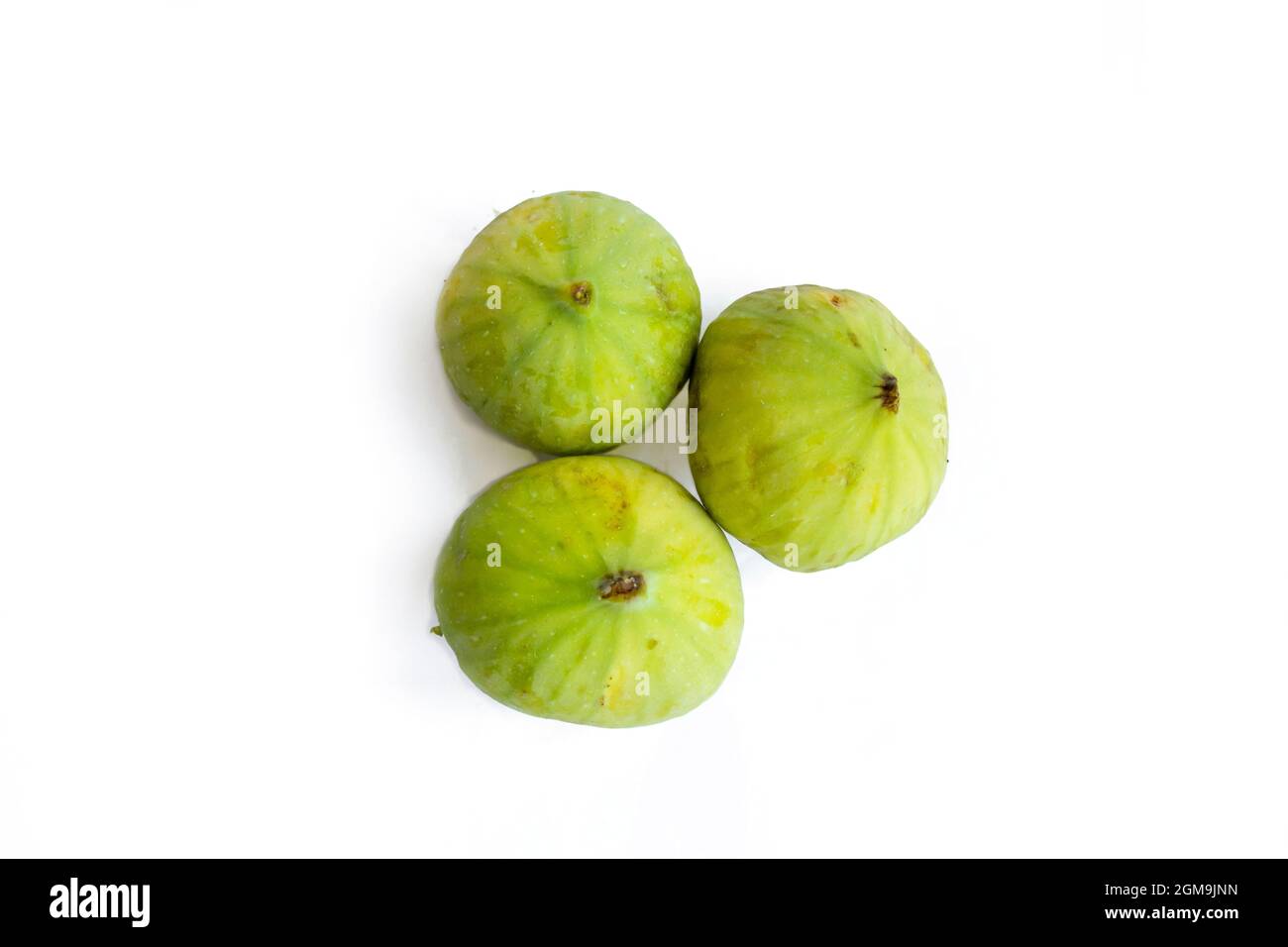 Green figs isolated on white background Stock Photo - Alamy