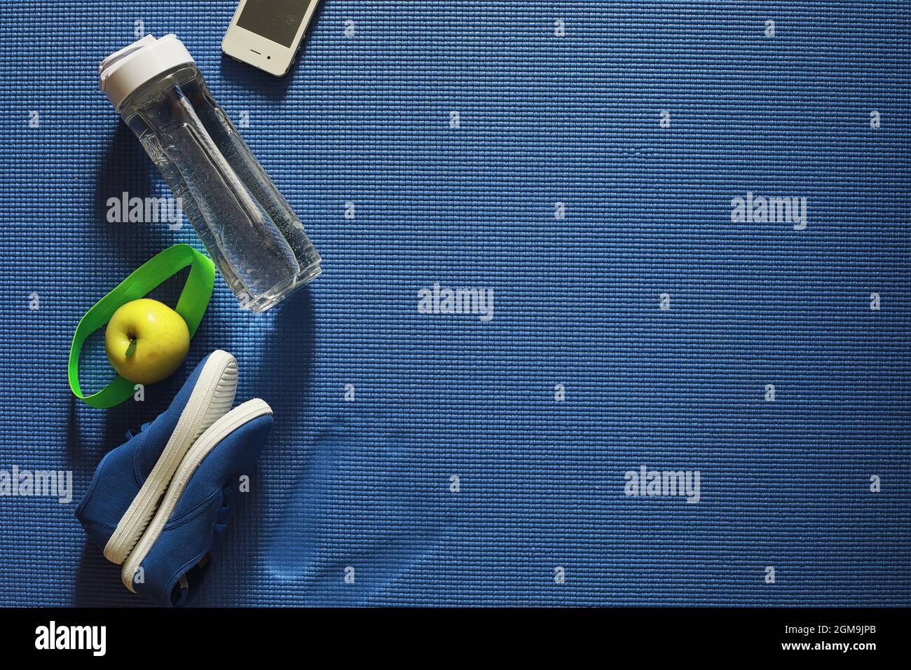 Mat for practicing yoga on a floor. Healthy lifestyle Stock Photo - Alamy