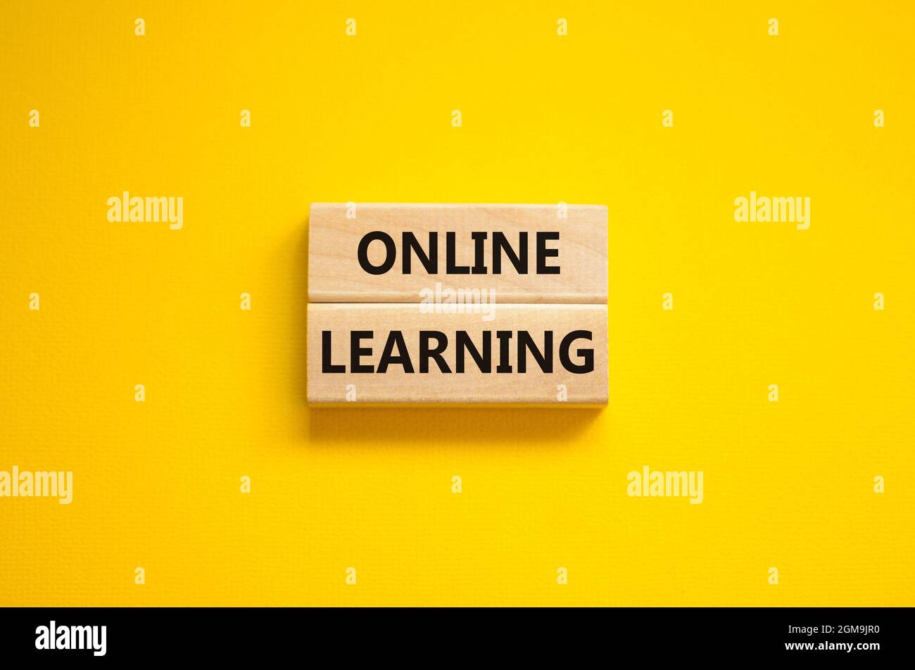 Online learning symbol. Concept words 'Online learning' on wooden ...