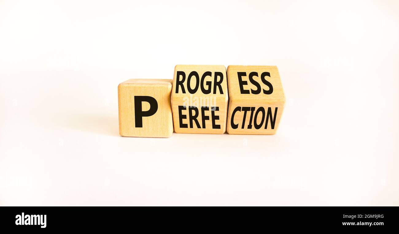 Progress or perfection symbol. Turned wooden cubes and changed the ...