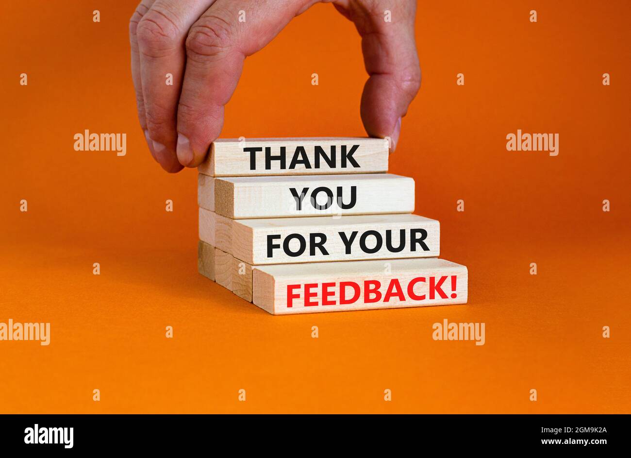 Thank you for your feedback symbol. Wooden blocks with concept words ...