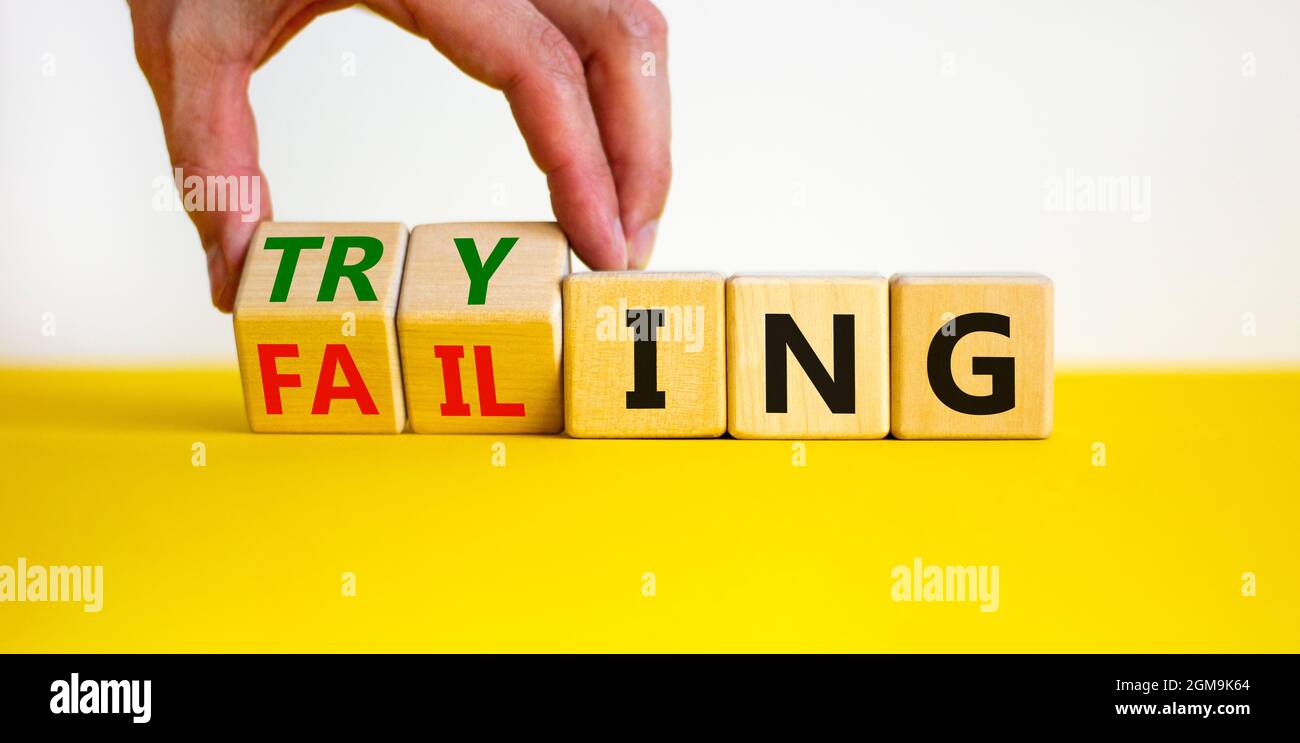 Failing or trying symbol. Businessman turns wooden cubes and changes ...