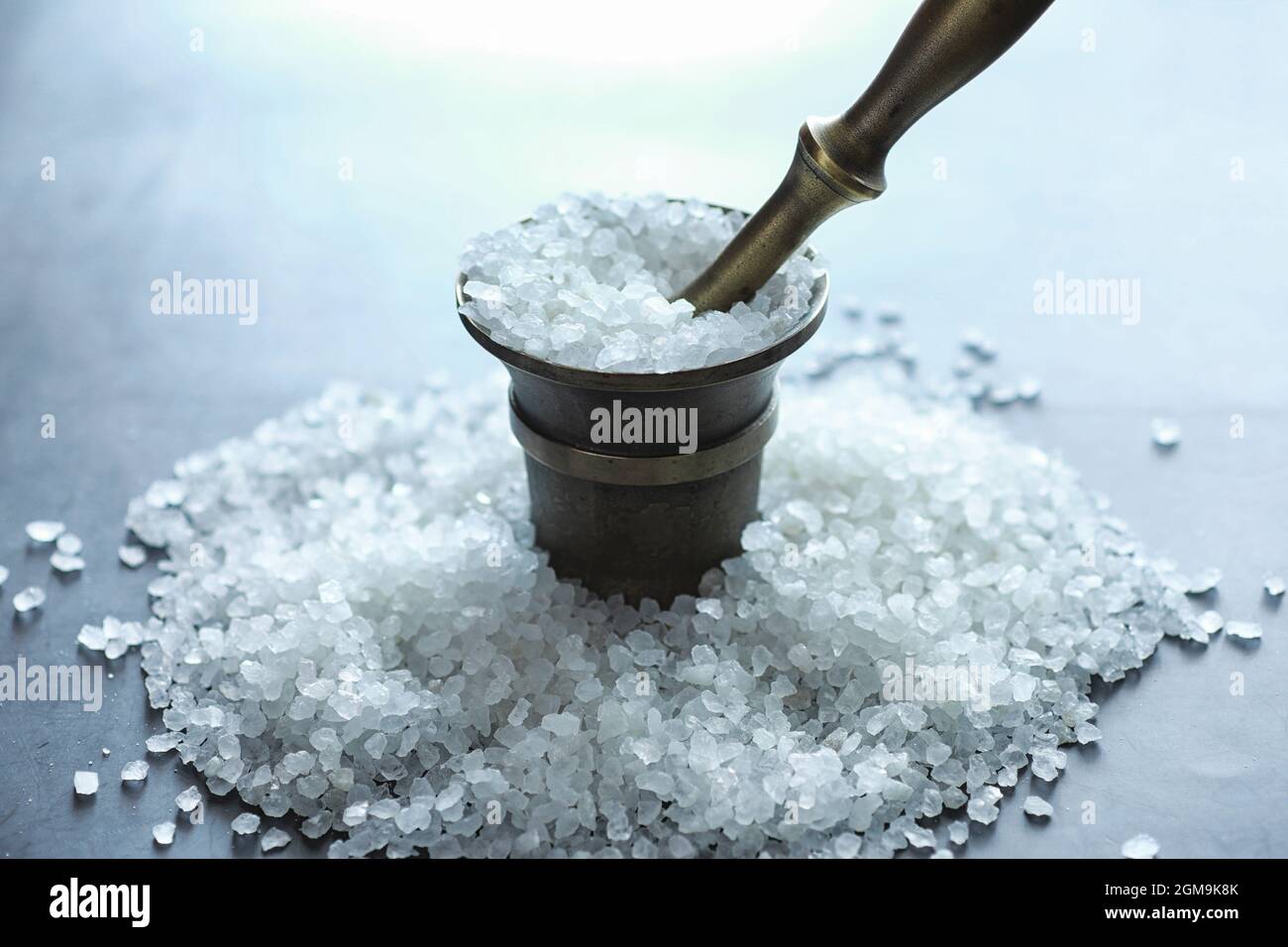 Large sea salt. Spice. Mortar and pestle for grinding salt Stock Photo ...