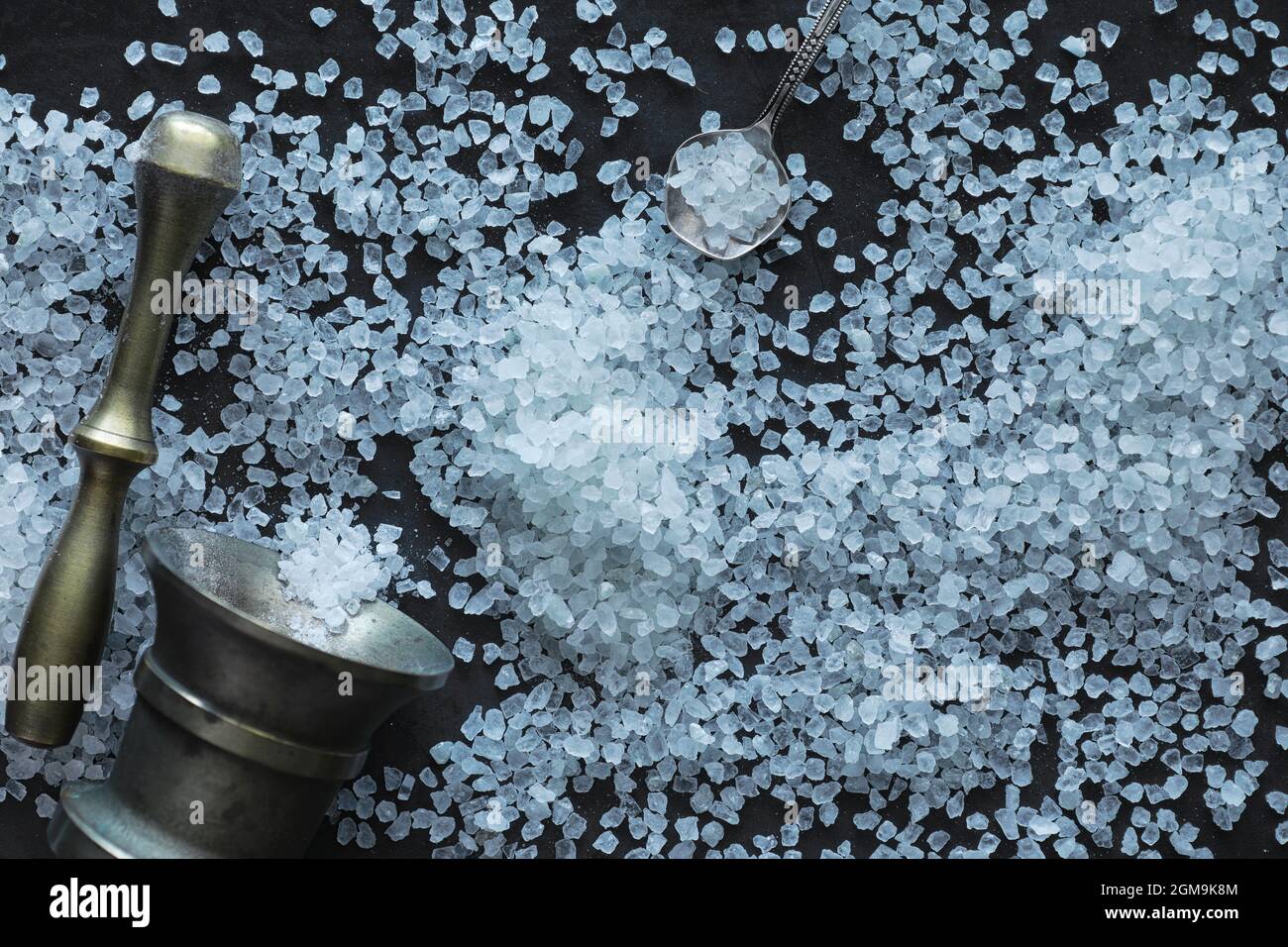 Large sea salt. Spice. Mortar and pestle for grinding salt Stock Photo ...