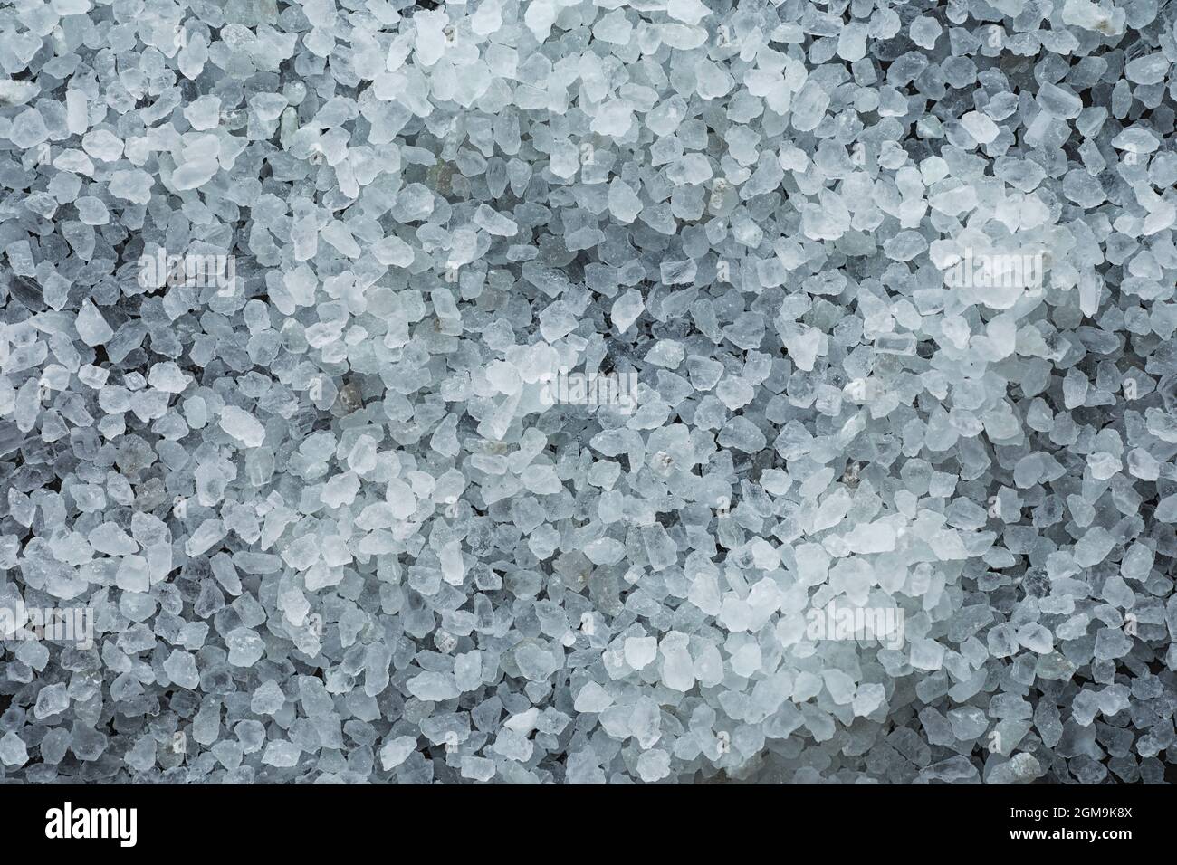 Large sea salt. Spice. Mortar and pestle for grinding salt Stock Photo ...