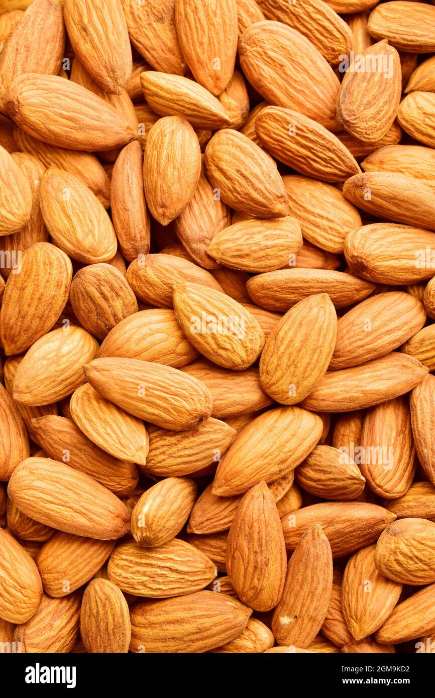 Organic almonds top view as background,. Healthy dry almonds top view ...