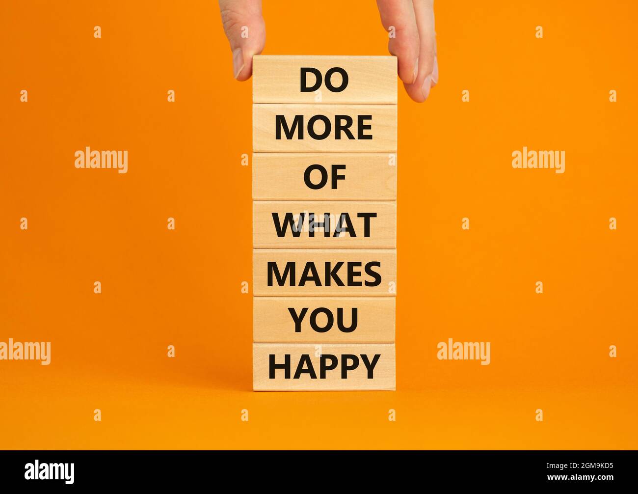 Do what makes you happy symbol. Wooden blocks with words 'Do more of ...