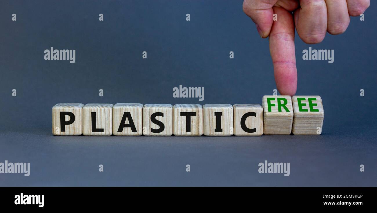 Plastic free and green business symbol. Businessman turns cubes ...