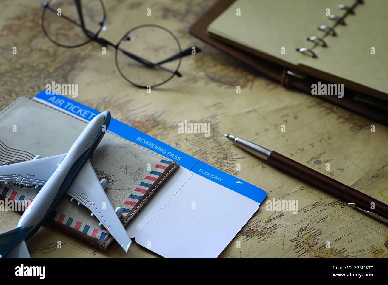 Travel concept. Map on the table and model aircraft Stock Photo - Alamy