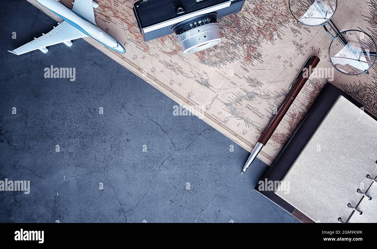 Travel concept. Map on the table and model aircraft Stock Photo - Alamy