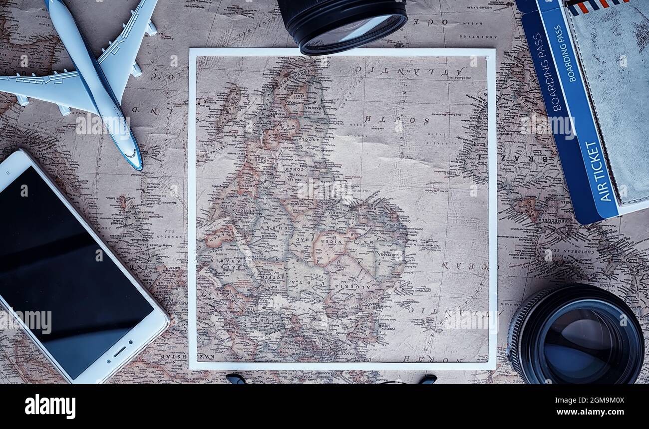 Travel concept. Map on the table and model aircraft Stock Photo - Alamy