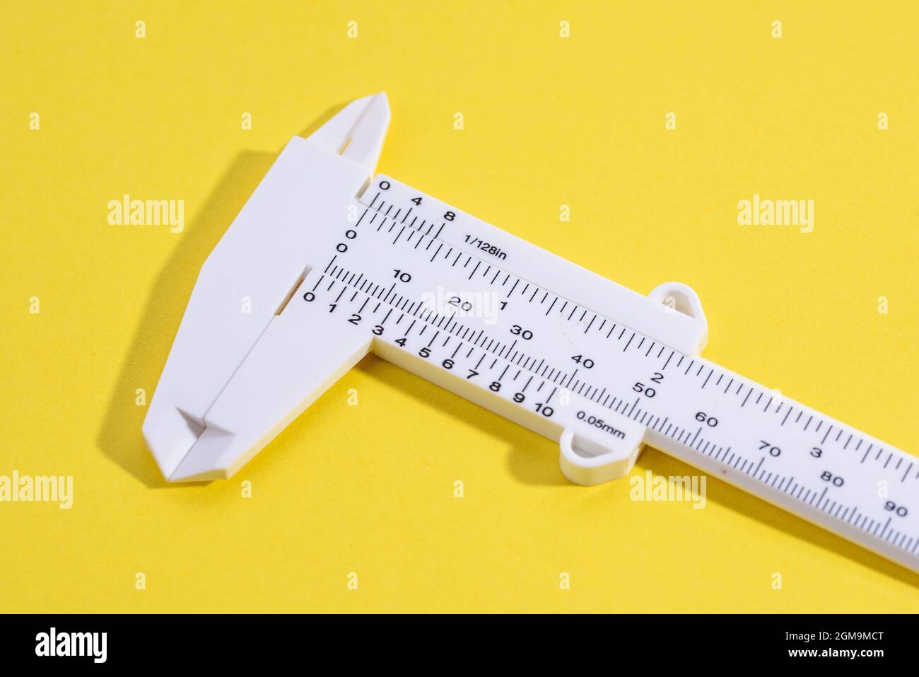 Caliper measuring instrument white. Isolated on white background Stock ...