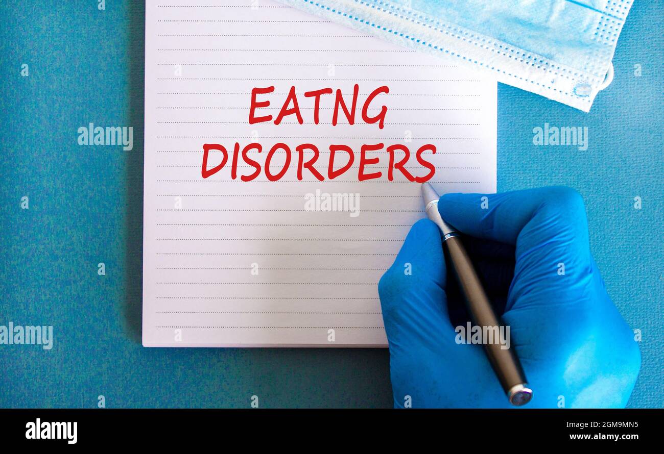 Eating disorders symbol. White note with words Eating disorders ...