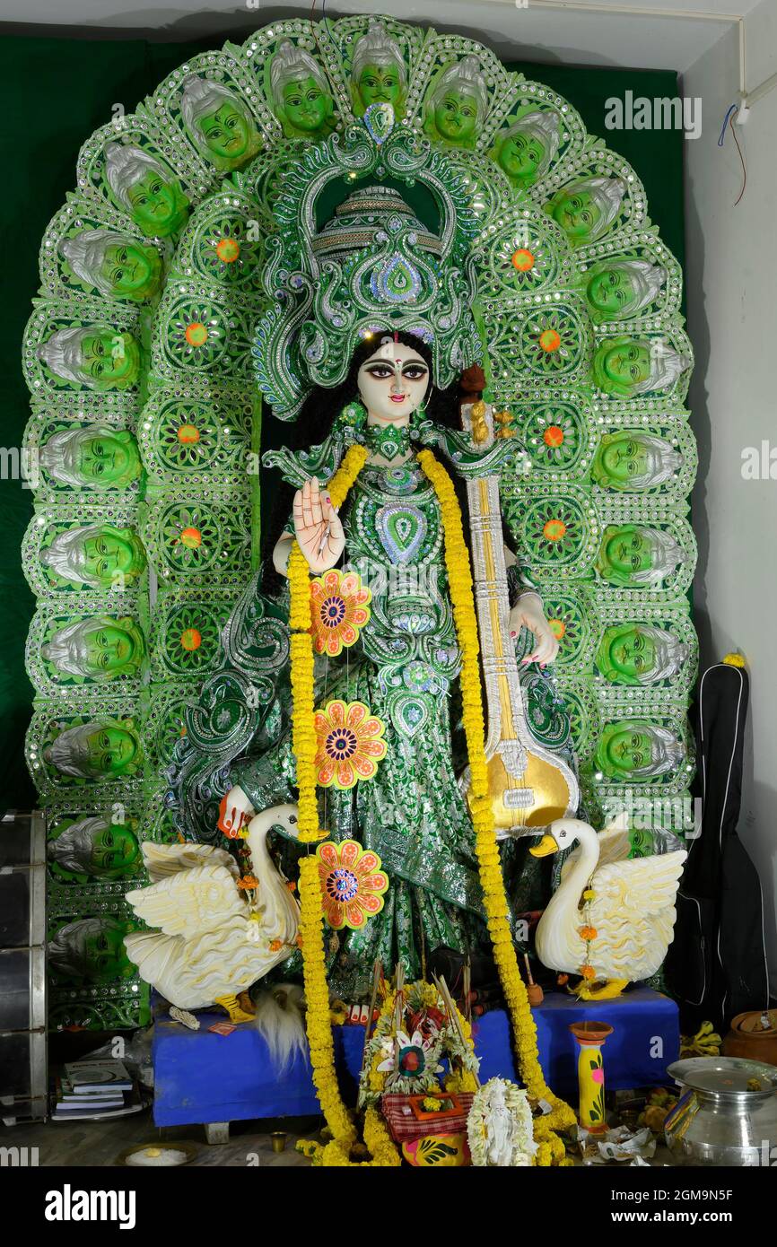 Idol of Goddess Saraswati being worshipped inside pandal , a temporary ...