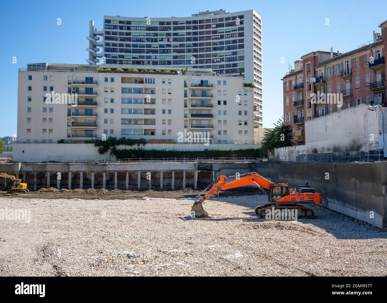 Large construction site in the city with excavator Stock Photo - Alamy