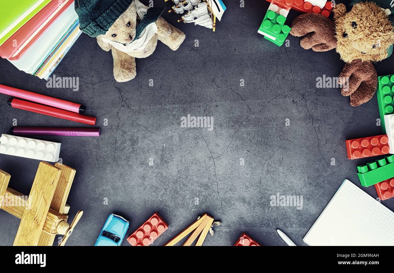 Background. Children's toys on the table. The space between kid's toys ...
