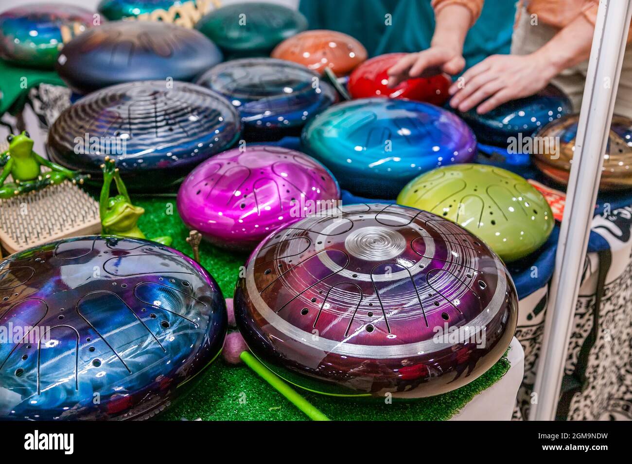 Exhibition and sale of unusual musical instruments - tank drum. Man ...